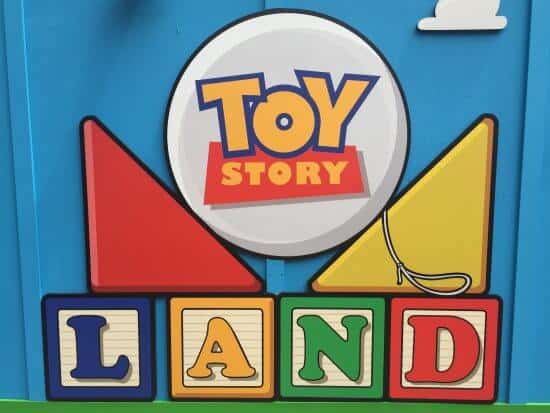 New 'Toy Story Land' art appears with logo on colorful construction ...